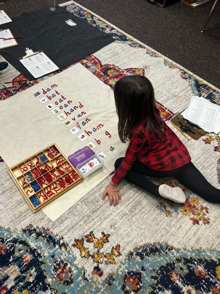 Learning to read and write using wooden alphabet. - Casa Niños School ...